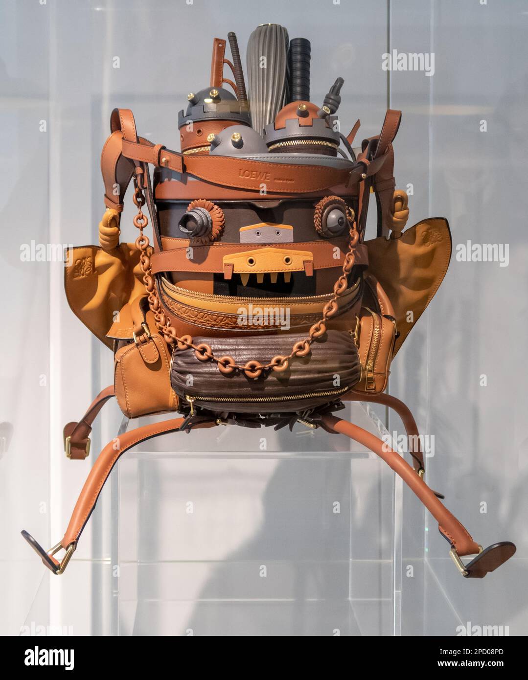 An eccentric looking Loewe leather backpack on display with a variety ...