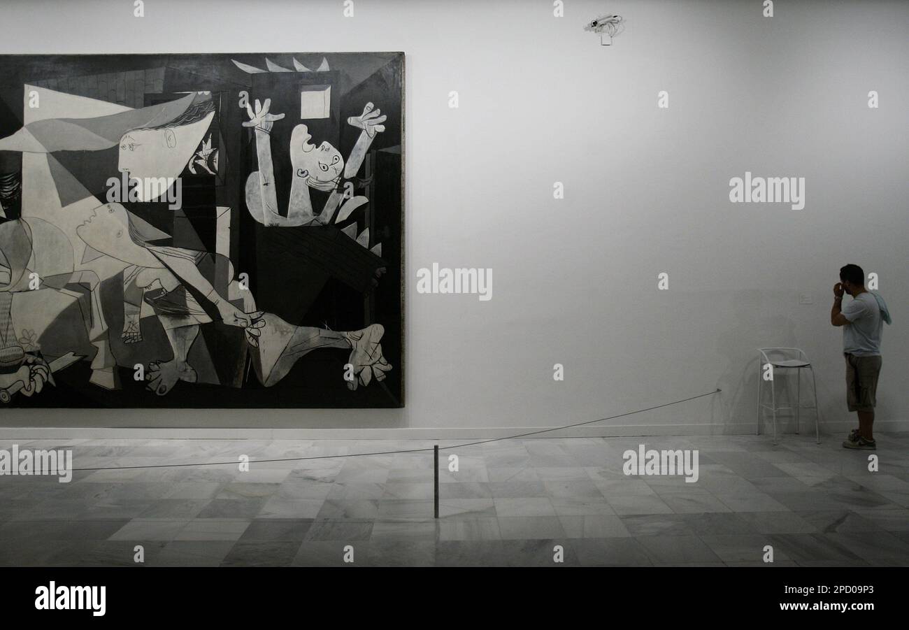 A visitor reads information of the Spanish artist Pablo Picasso's world ...