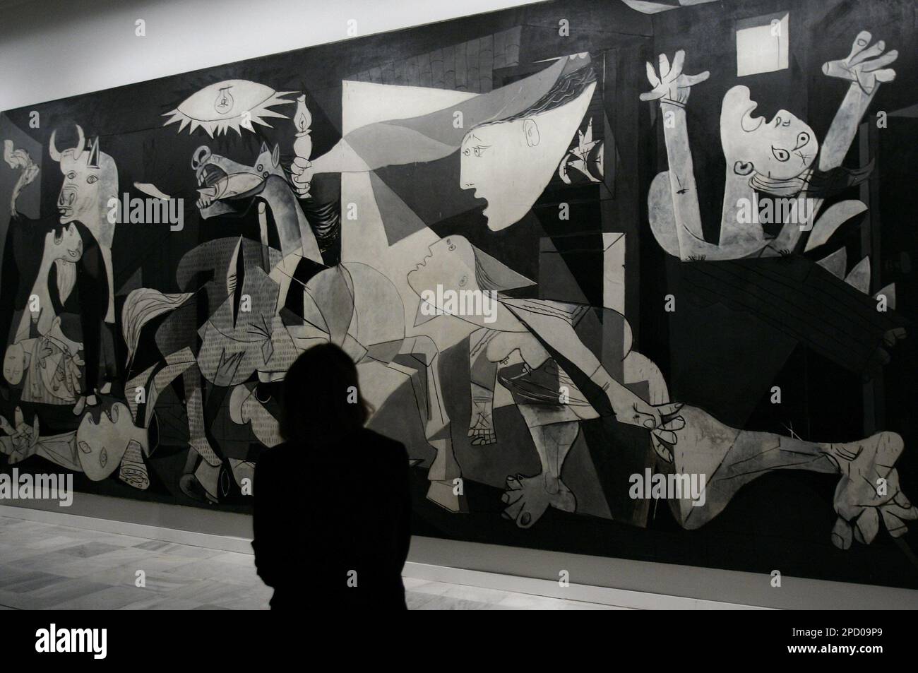 A visitor views Spanish artist Pablo Picasso's world famous painting ...