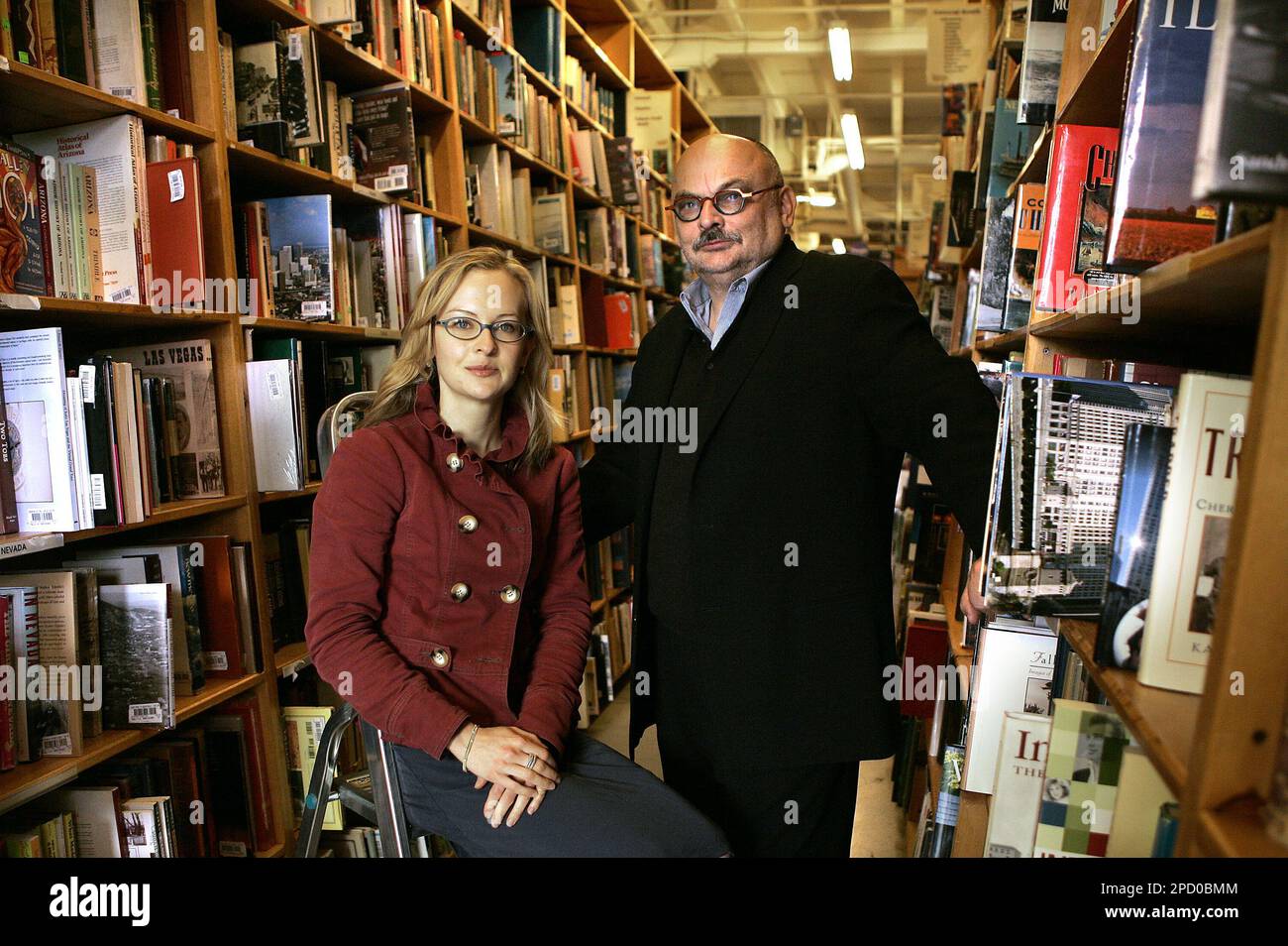 Michael Powell, right, owner of Powell's Books, poses with his daughter ...