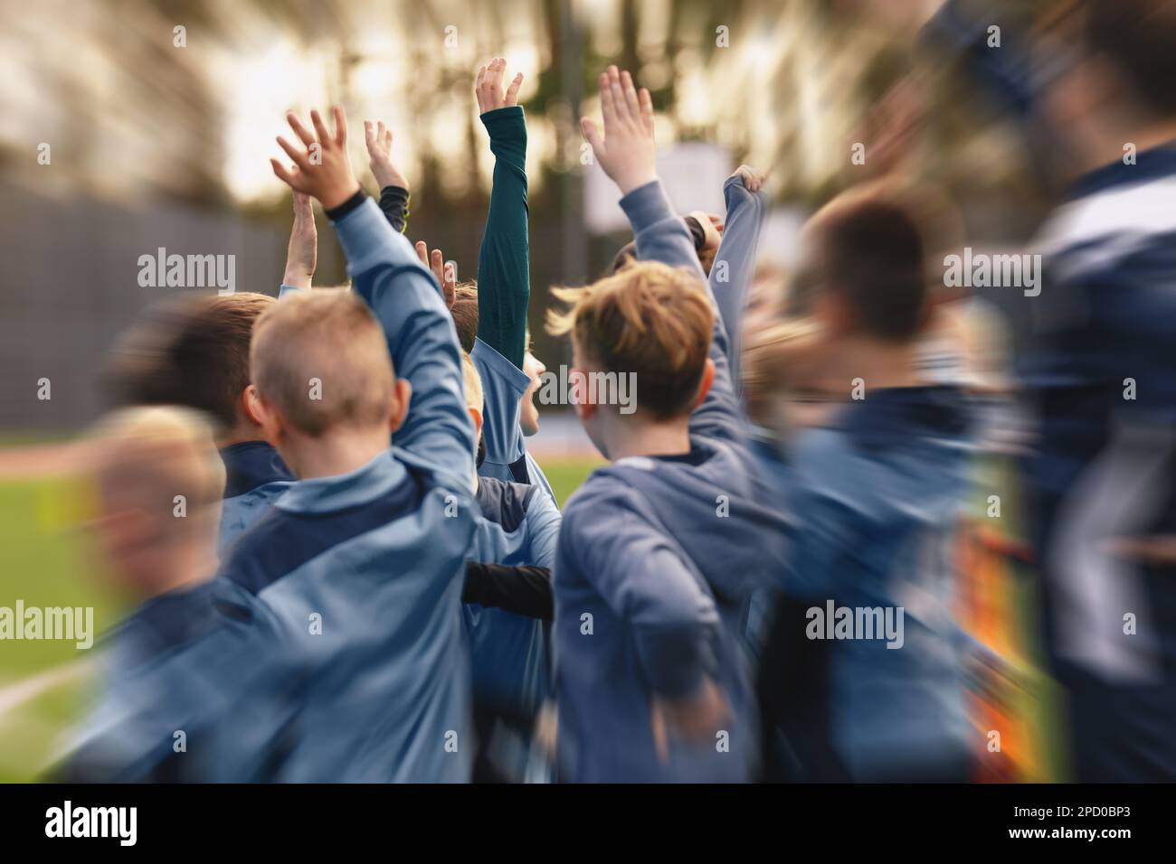 Sporty Group of School Kids Rising Hands in a Circle. Bunch of Children ...