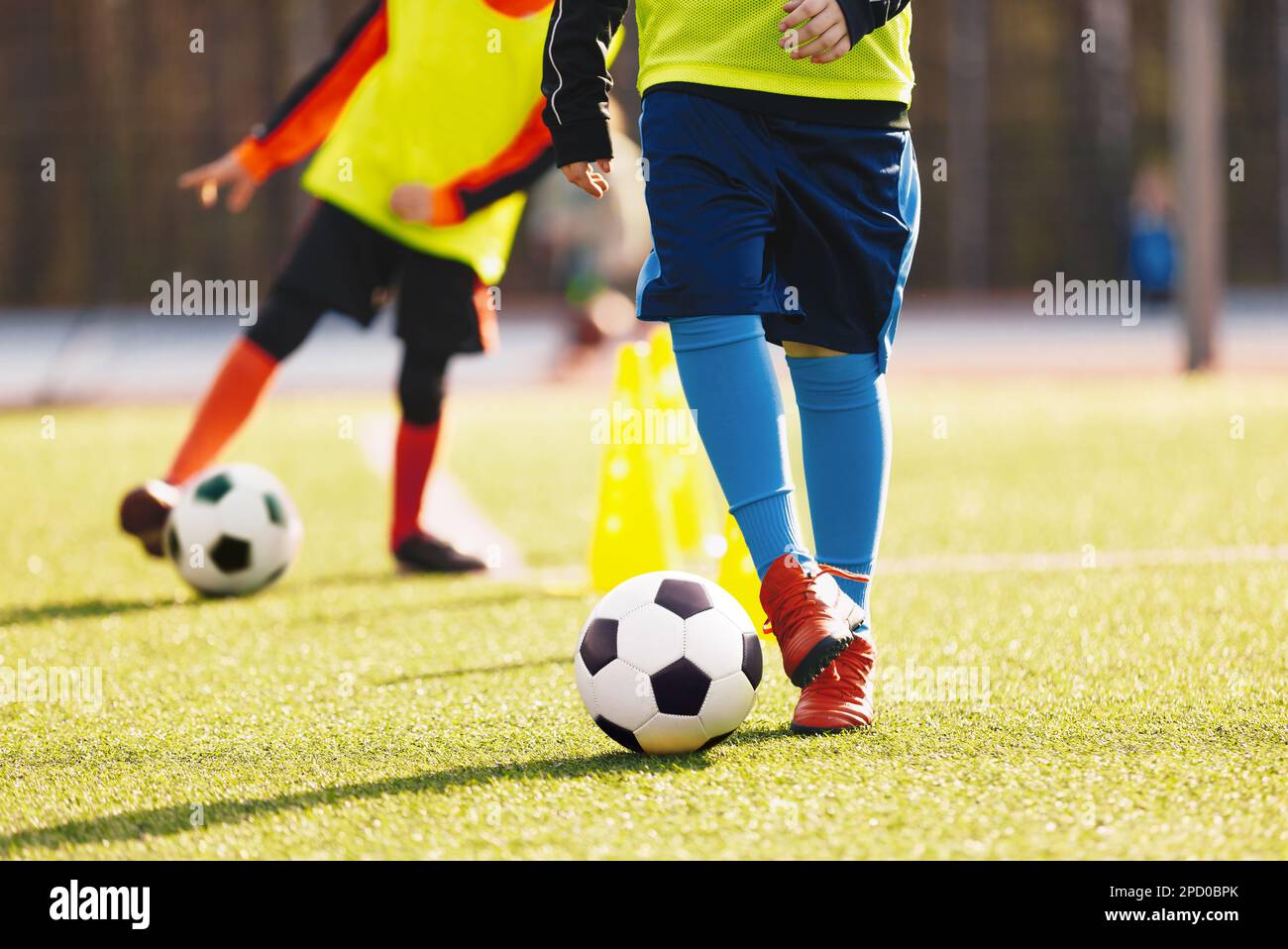Kids in soccer winter clothing at training drill during winter practice ...