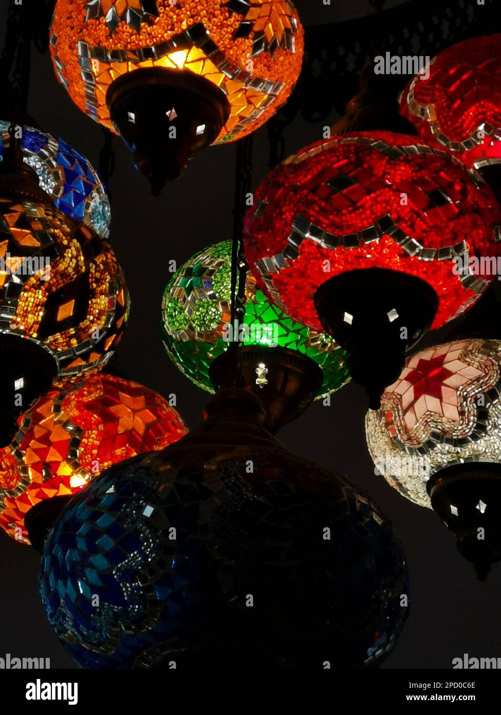 Vertical image of vivid Turkish glass lamps in red and other colours ...