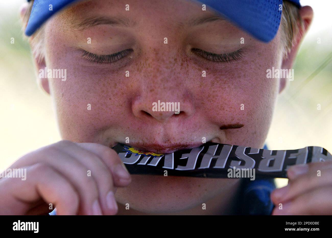 Caleb Lang smears chocolate on his face as he snacks on a melted ...