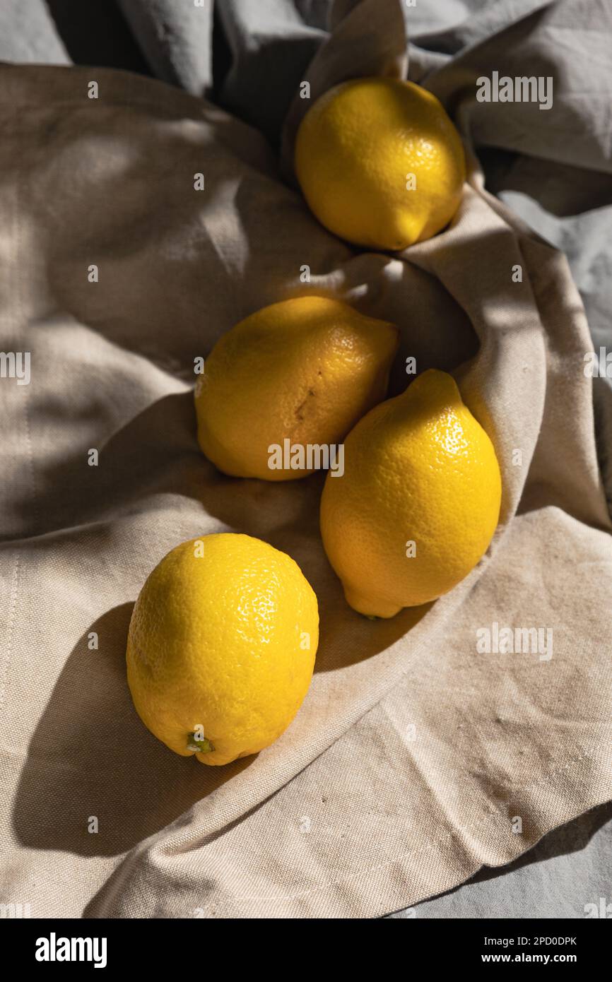 Fresh Sicilian lemons from the garden on the textile napkin in the ...