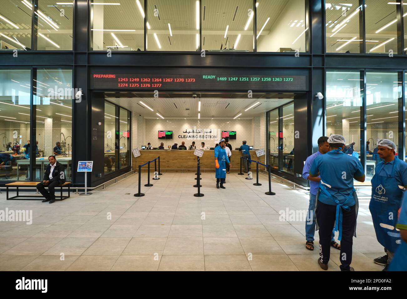 The entrance, ordering, cashier section with waiting numbers sign. The ...