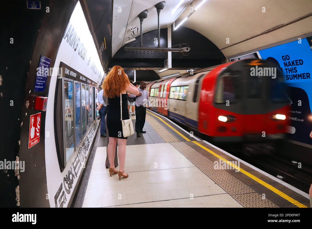 LONDON, UK - JULY 12, 2019: Passengers at London Underground station ...
