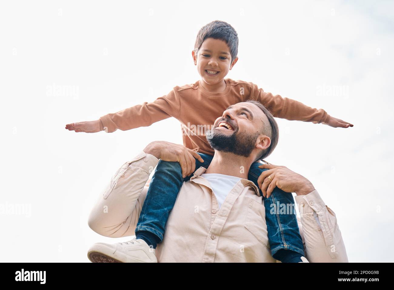 Family, kids and boy sitting on the shoulders of his father outdoor ...