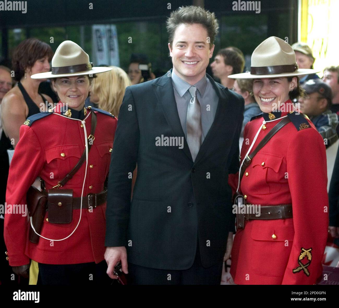 Brendan Fraser poses with members of the RCMP as he arrives for ...