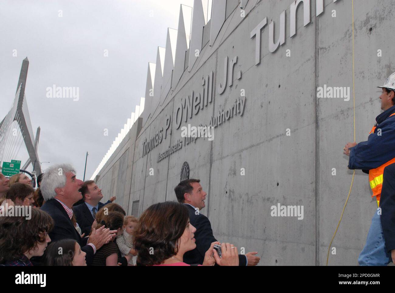 Tom O'Neill, left, applauds as the O'Neill clan gathers for the ...