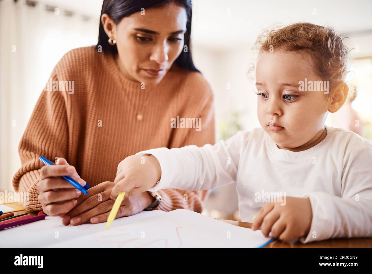 Home school, learning and mother doing an activity with her child for ...