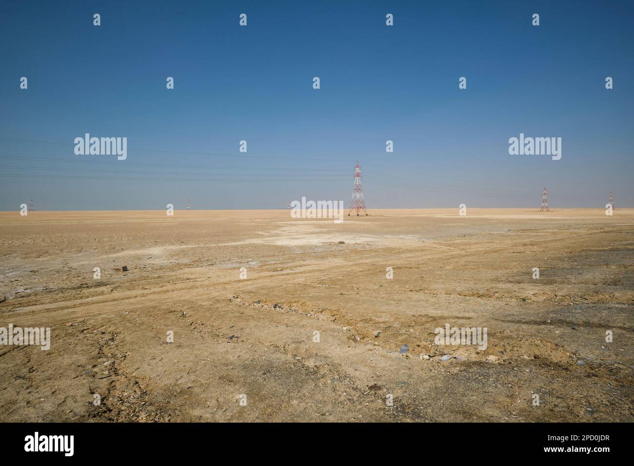 Electric power transmission lines strung between metal support towers ...