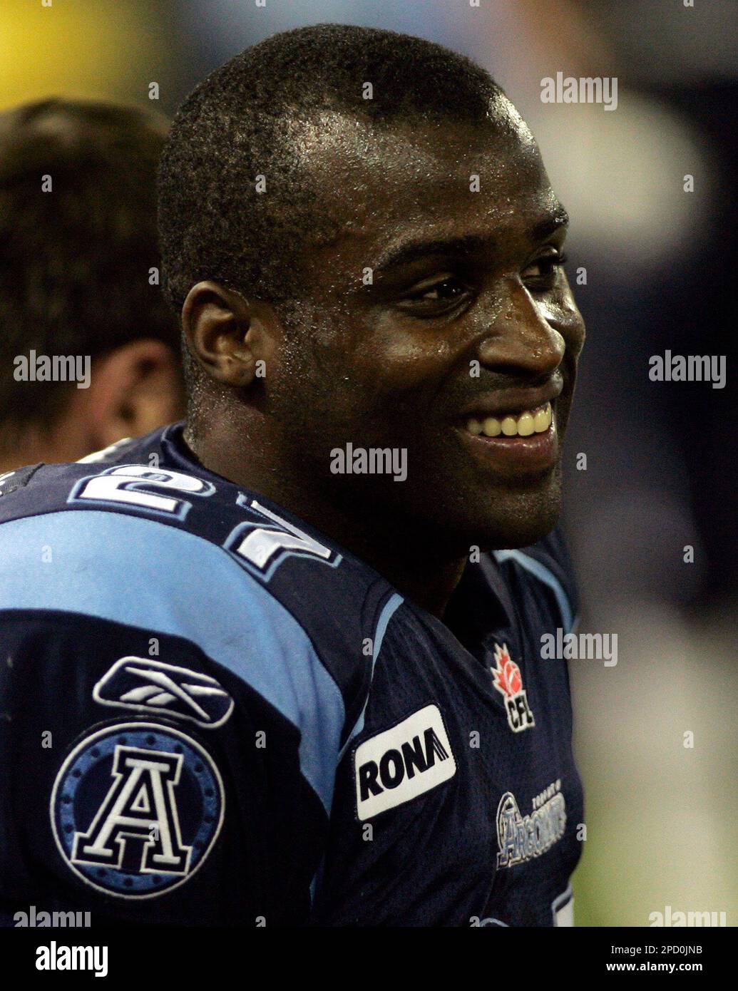 Toronto Argonauts' Ricky Williams smiles as he sits on the bench during ...