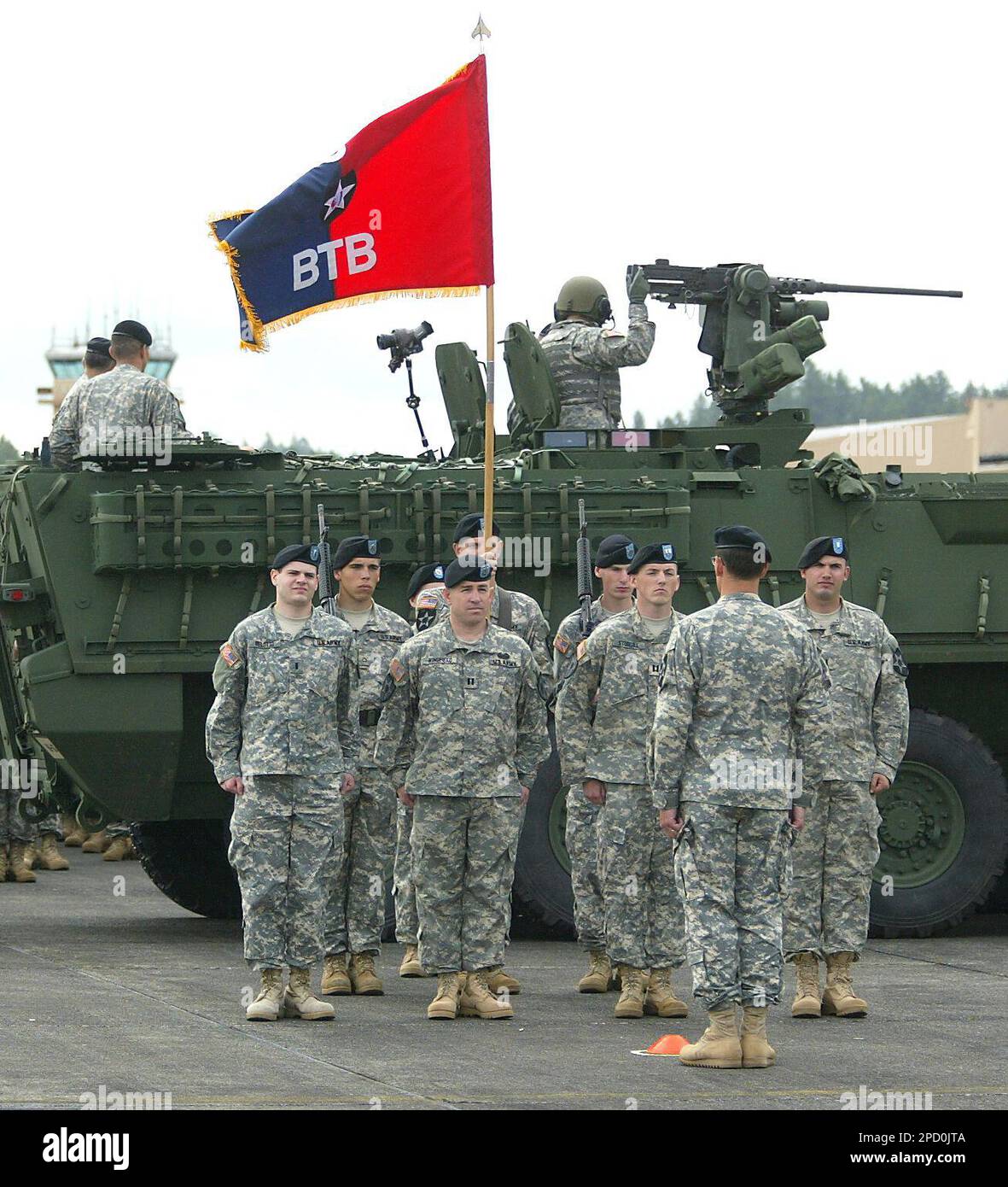 One of the units with the 3rd Stryker Brigade Combat Team stand at ...
