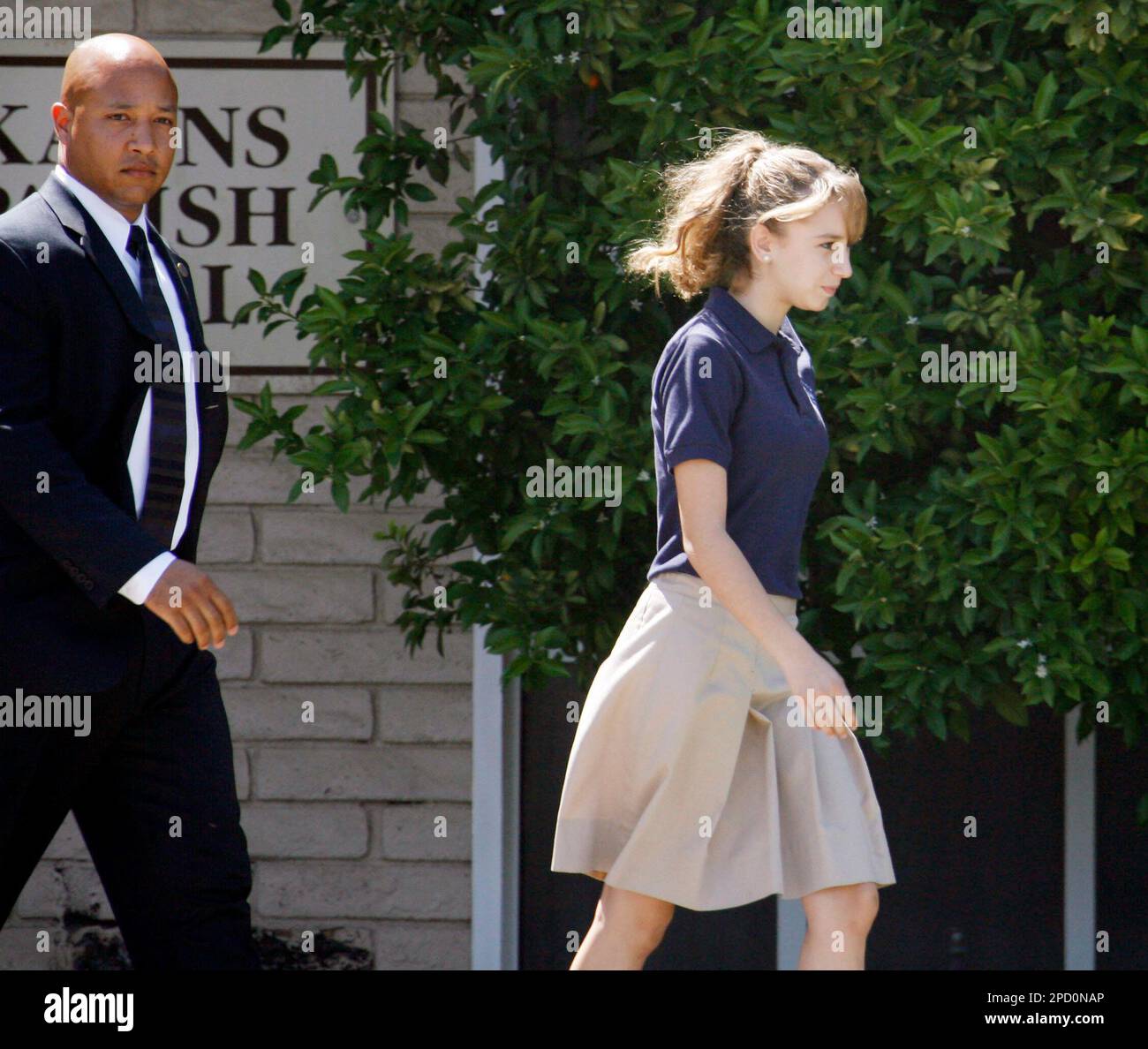 Security personnel escorts student Jazmin Grace Grimaldi, the 14-year ...