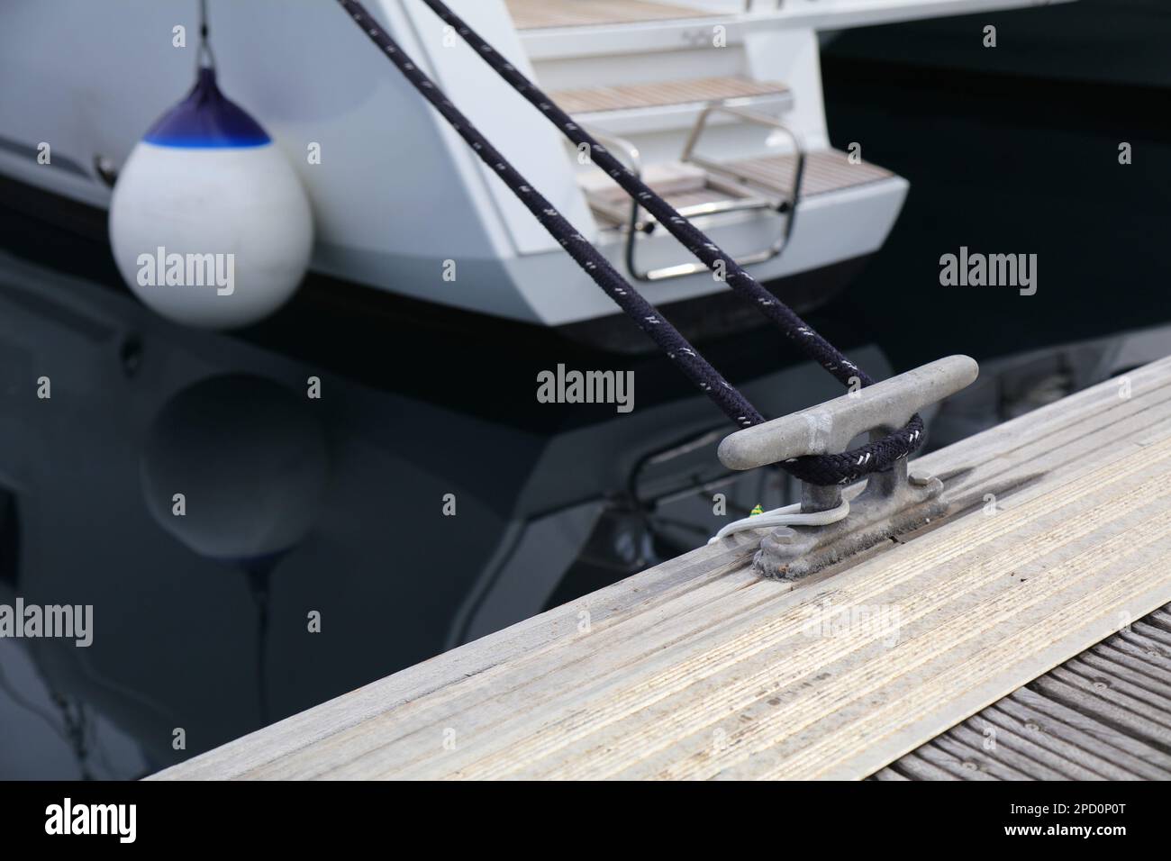 Sailing in Croatia. Sailing yacht ropes tied to a mooring bollard in ...