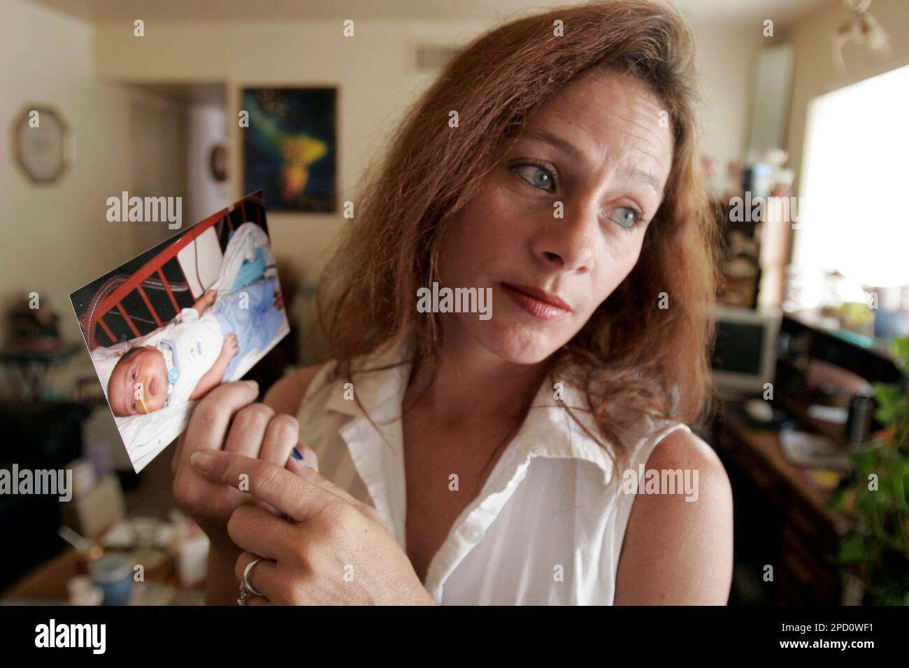 Dixie Belcher shows a photo of her son Daniel Wayne Cullen at her ...