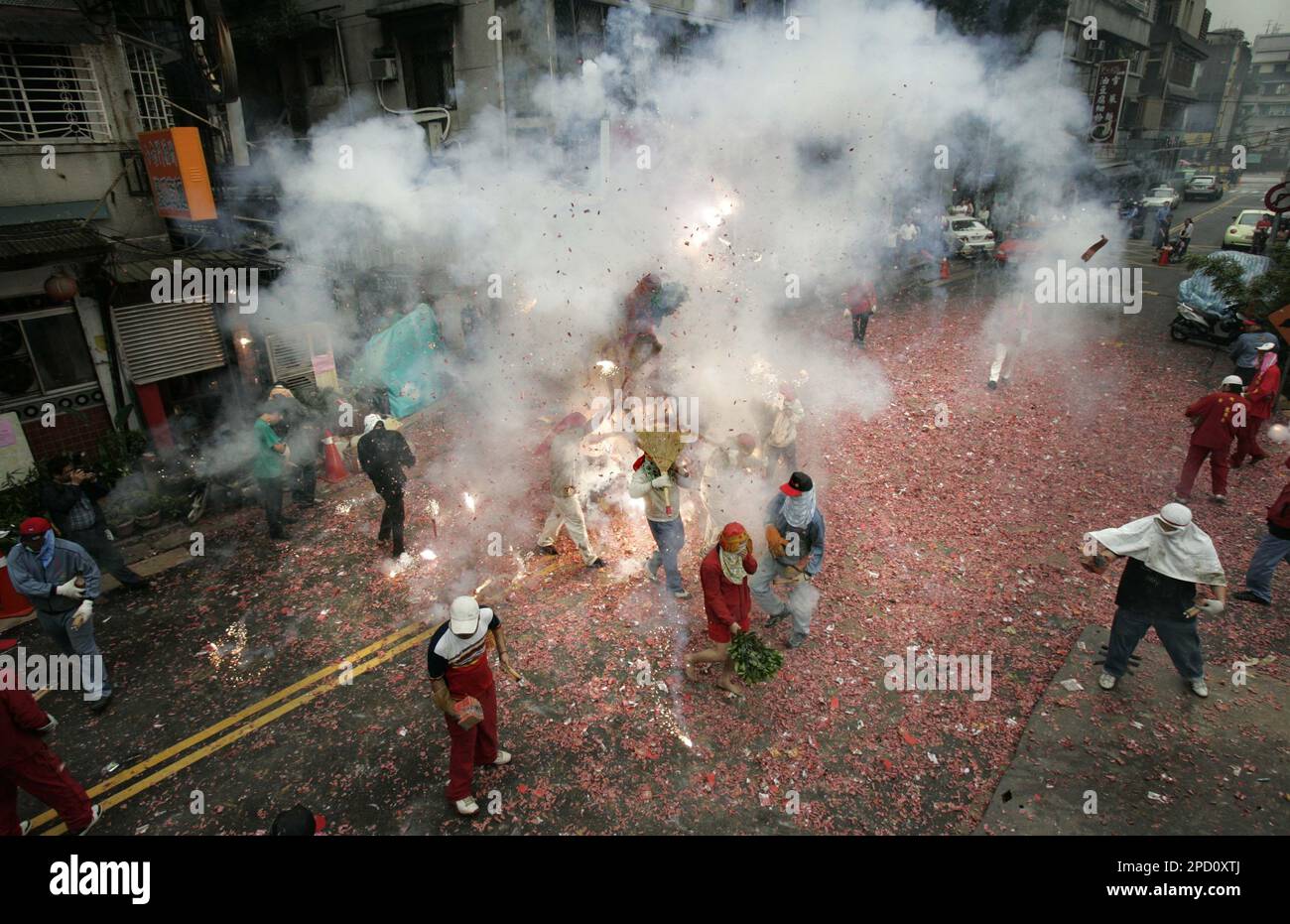 Taiwanese men perform Chinese folklore rituals to bring good luck and ...