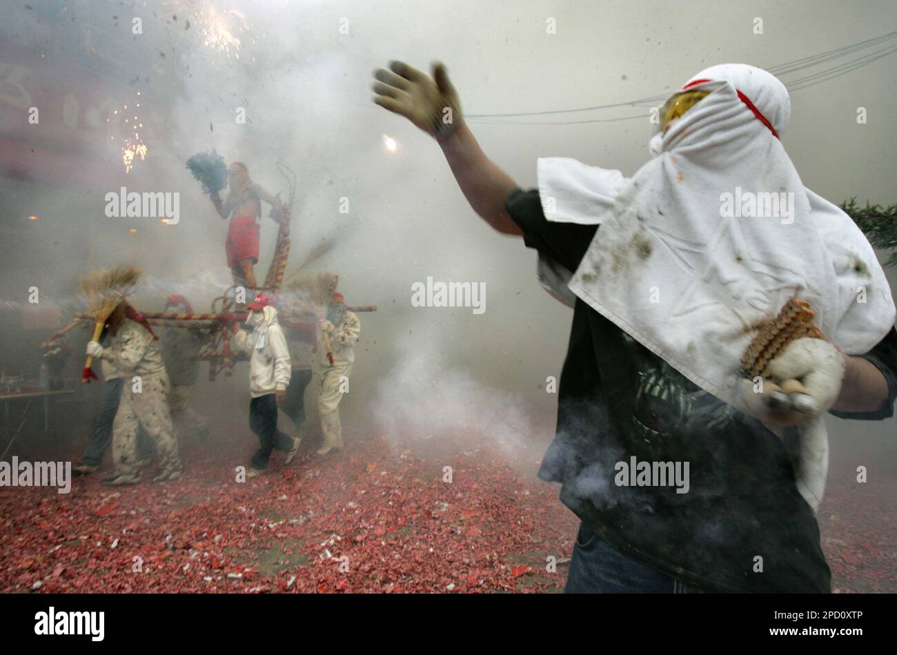 Taiwanese men perform Chinese folklore rituals to bring good luck and ...