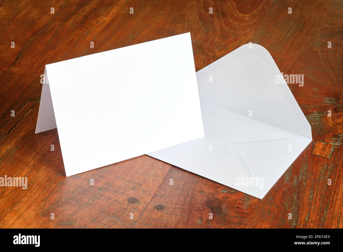 Standing blank empty rectangular greeting card and envelope mock up on ...