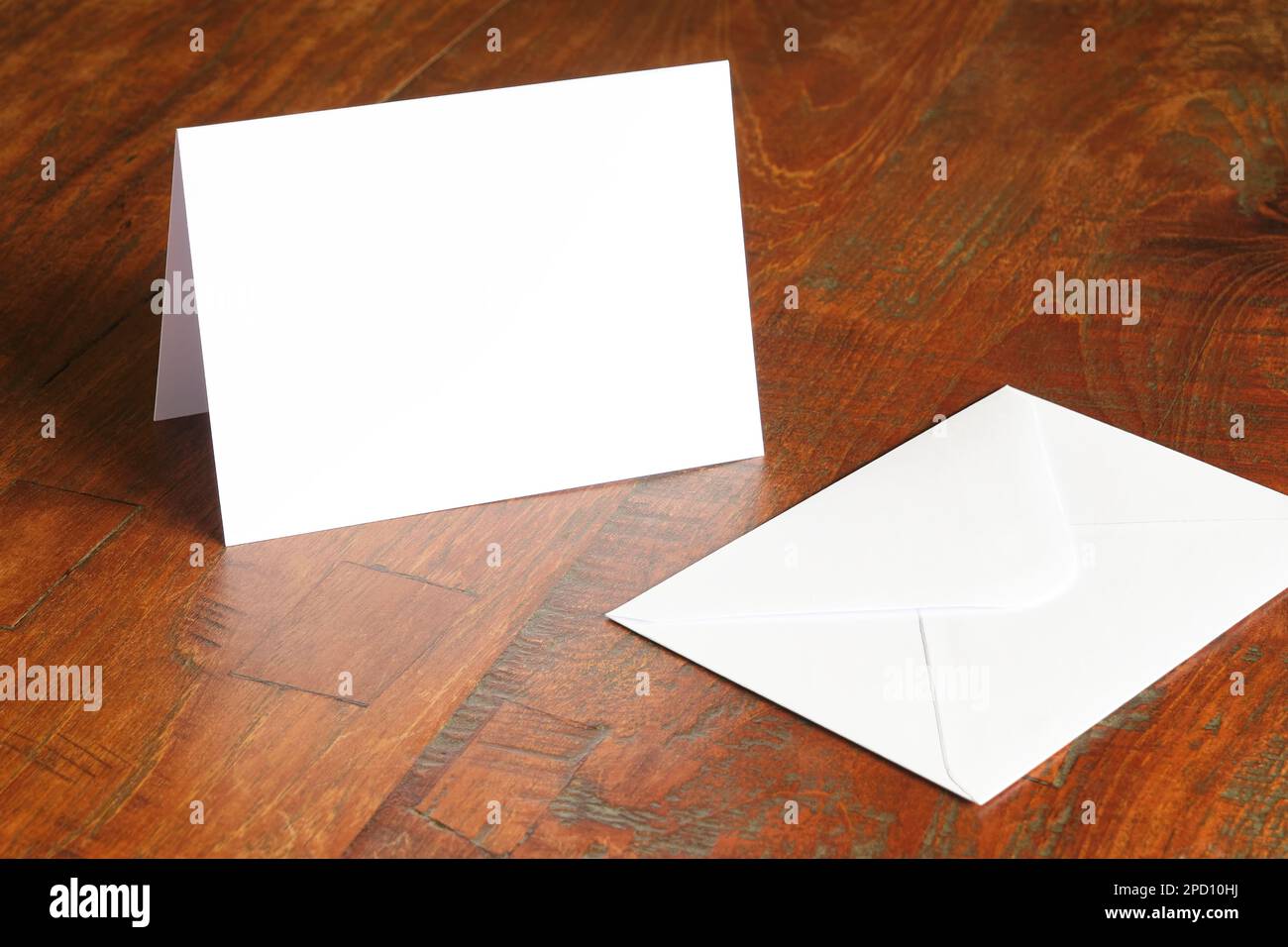 Standing blank empty rectangular greeting card and envelope mock up on ...