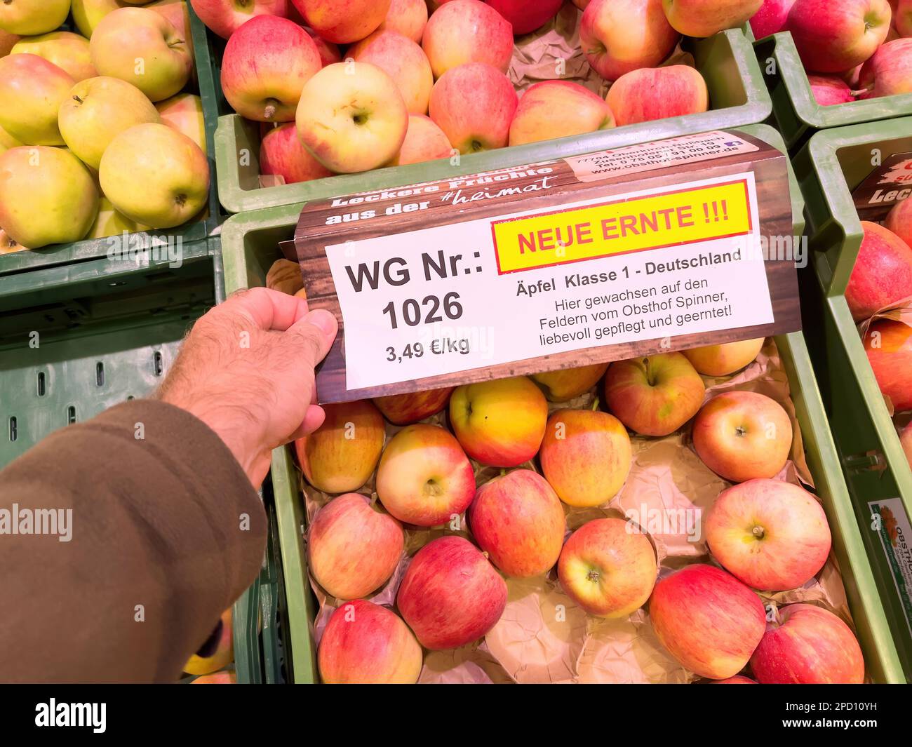 Germany - Sep e, 2022: POV male hand buying red yellow apples Apfel ...