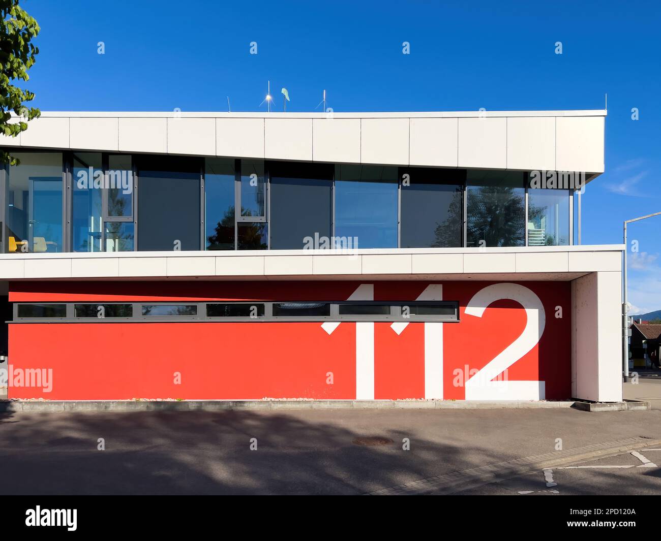Side view of emergency firefighter building with printed large 112 ...