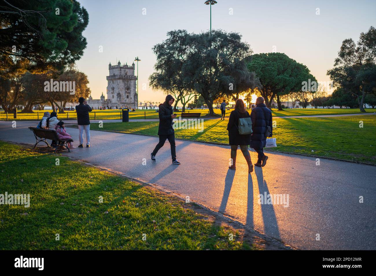 People enjoying Belen Tower Garden (Jardim da Torre de Belem) at sunset ...