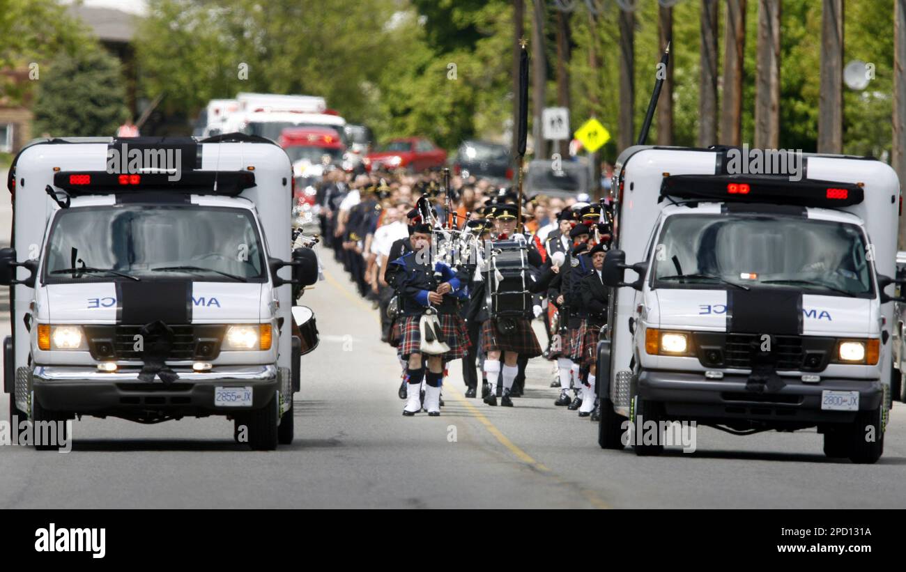 Ambulances lead a procession honoring fallen paramedics Kim Weitzel, 44 ...