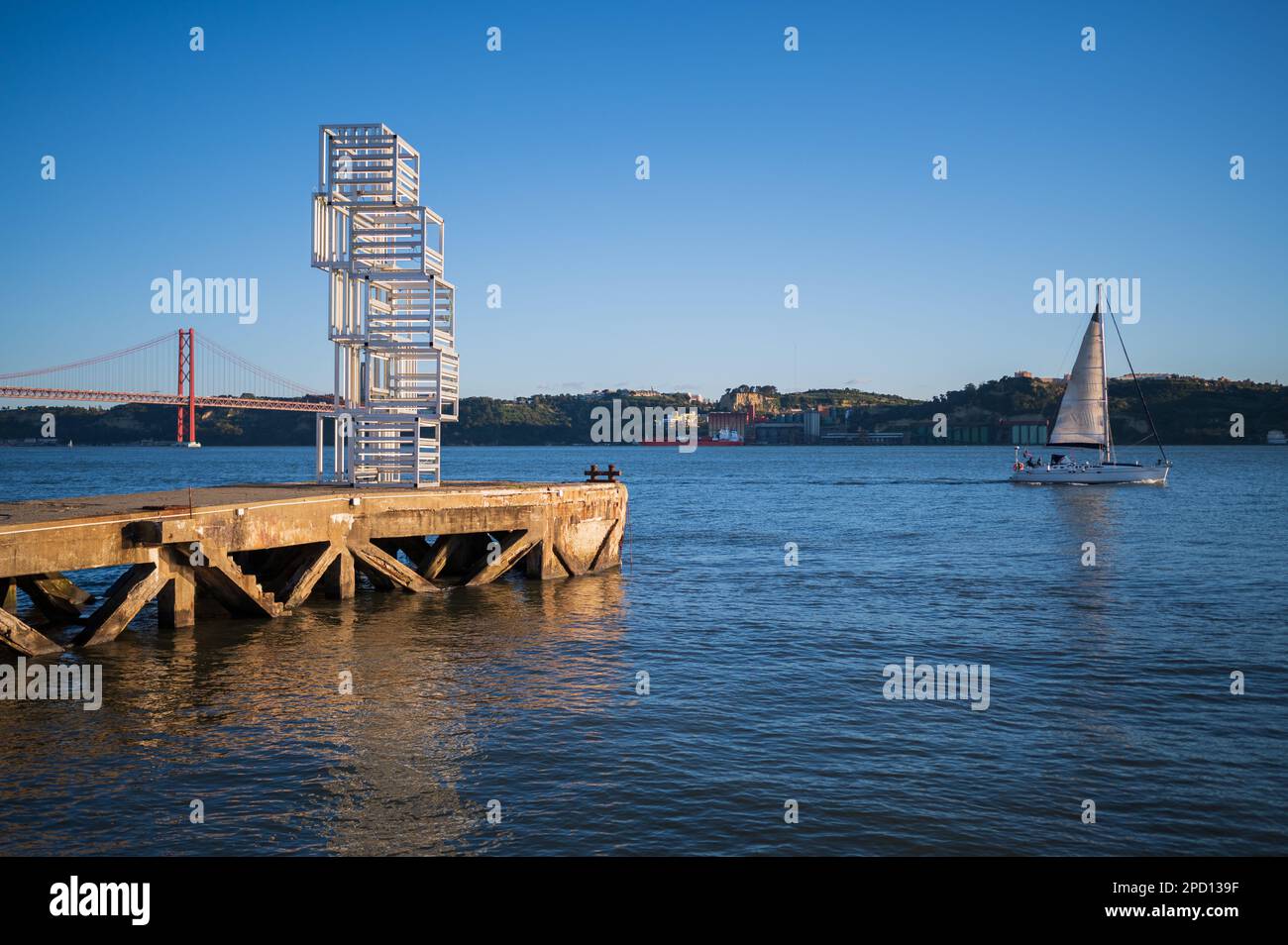 Riverside Escultura de Luz sculpture and Ponte 25 de Abril bridge by ...