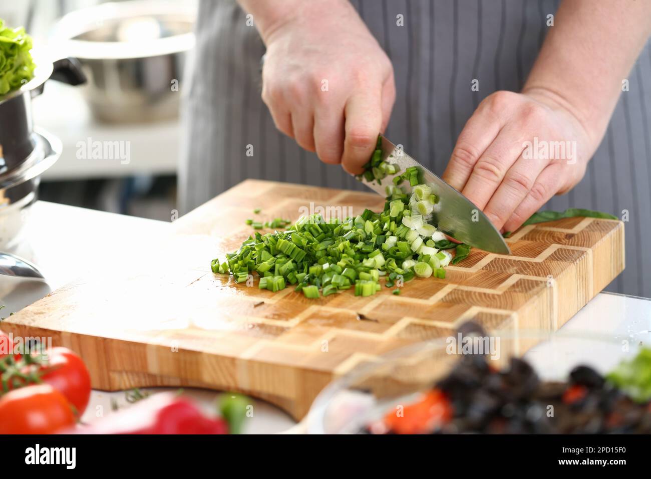Chef cutting spring onions knife hi-res stock photography and images ...