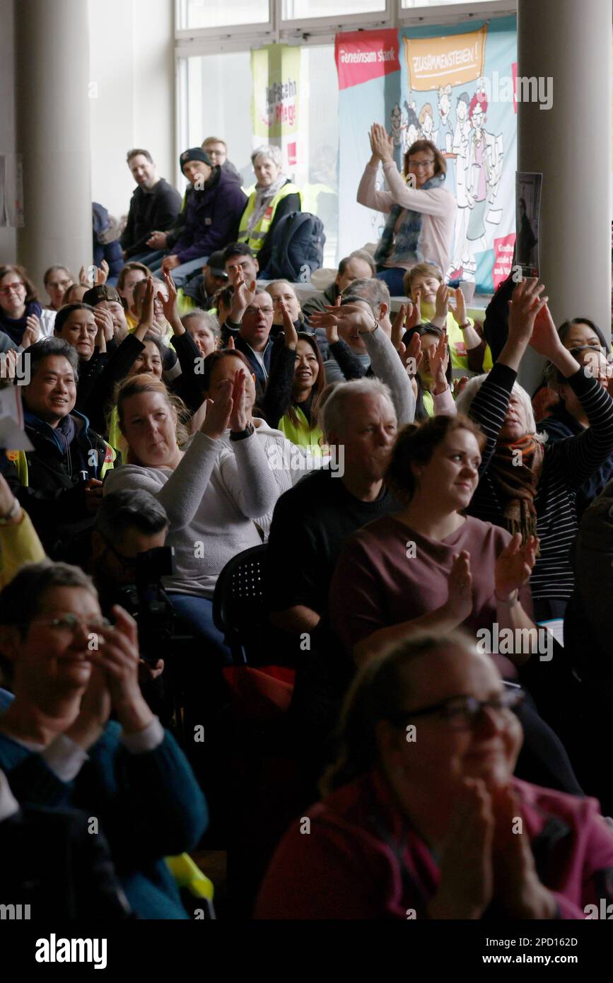 Berlin, Germany. 14th Mar, 2023. Participants of a strike meeting clap ...