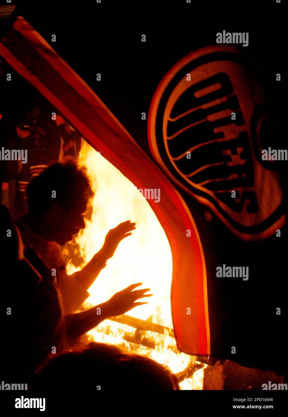 Edmonton Oilers fans set fire to telephone booths and street signs on ...