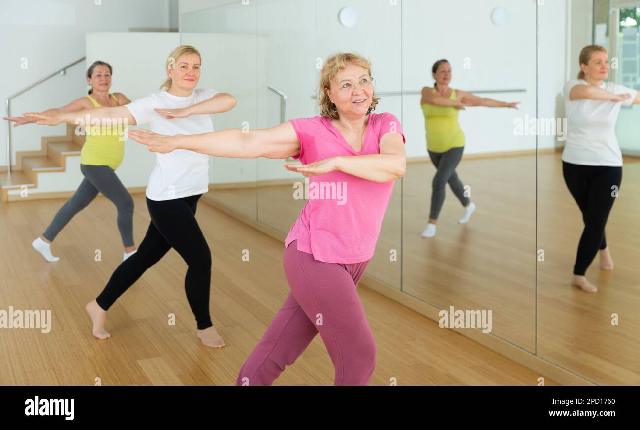 Mature women training at group dance class Stock Photo - Alamy