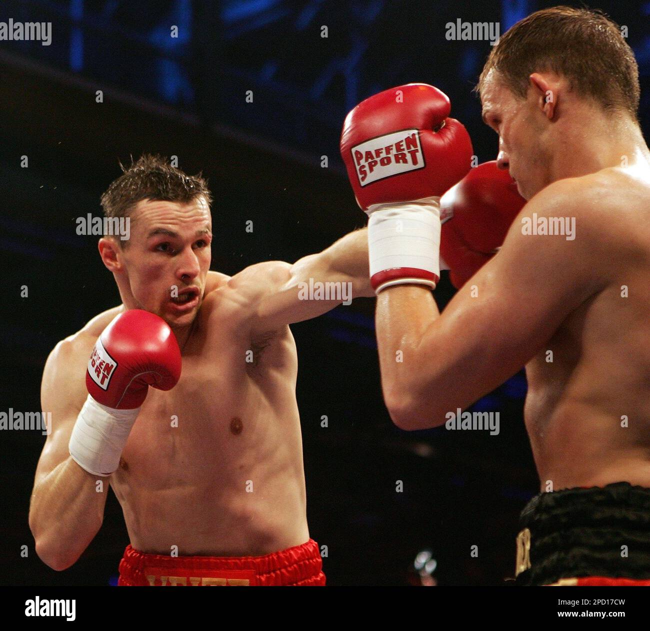 German boxers Juergen Braehmer, right, and Mario Veit, left, exchange ...
