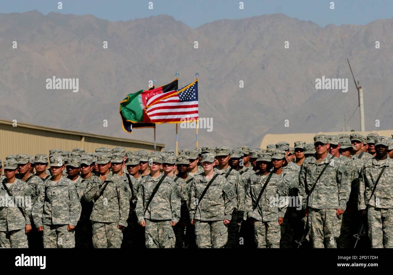 U.S. soldiers stand in a formation during a Memorial Day ceremony held ...