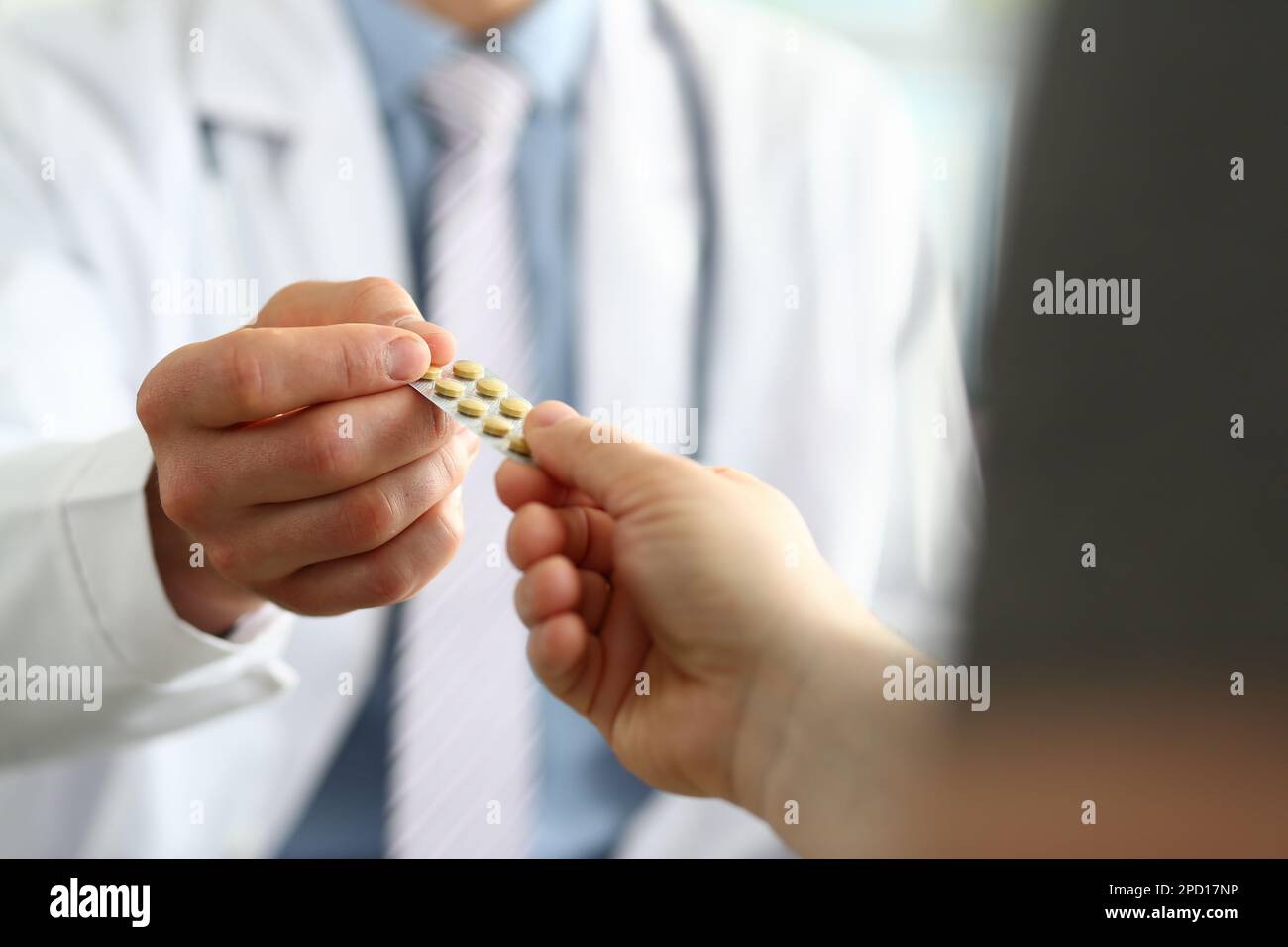 Doctor giving medications pills hi-res stock photography and images - Alamy