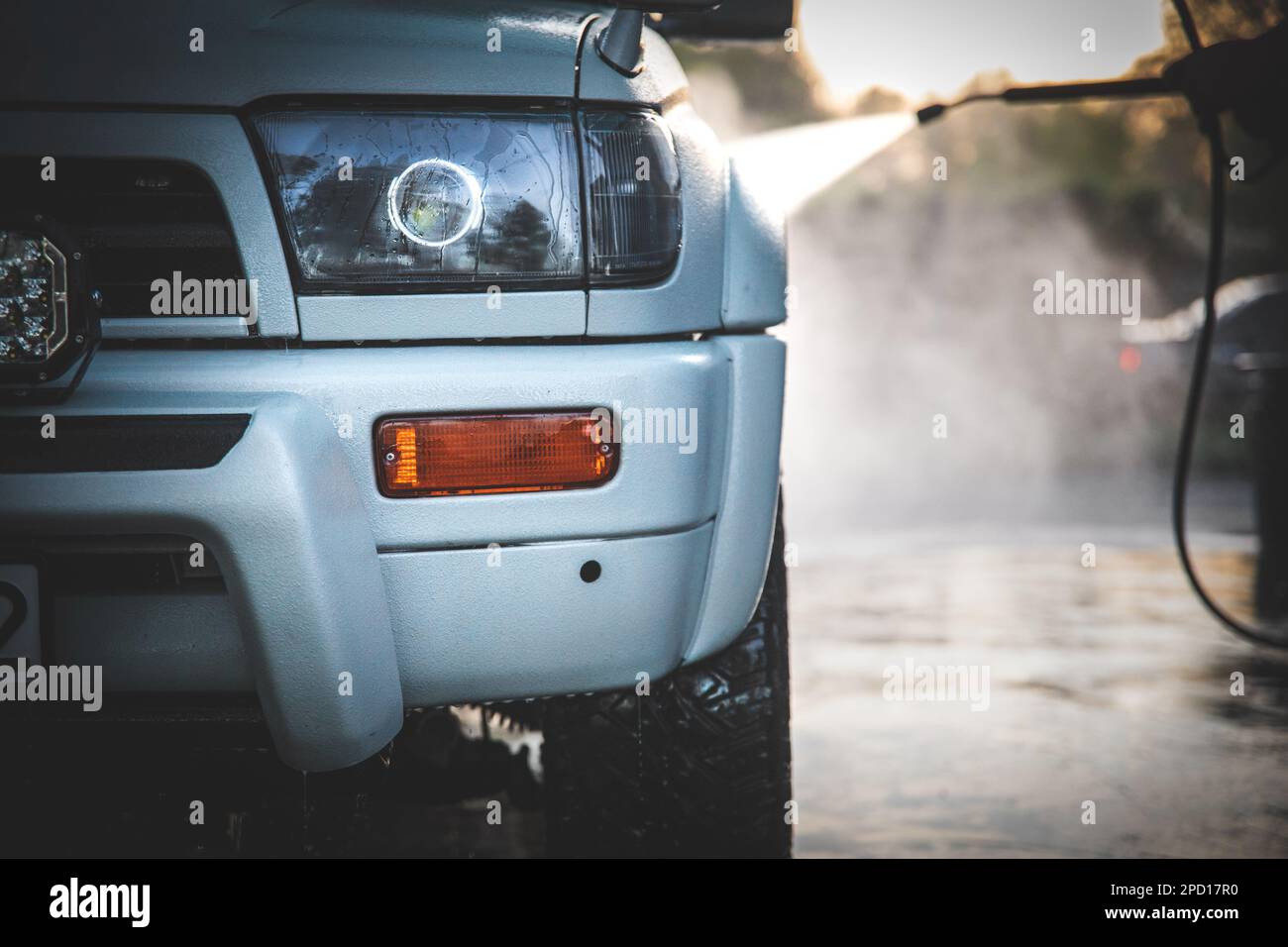 Human washing white car on contactless self-service car wash. Car ...