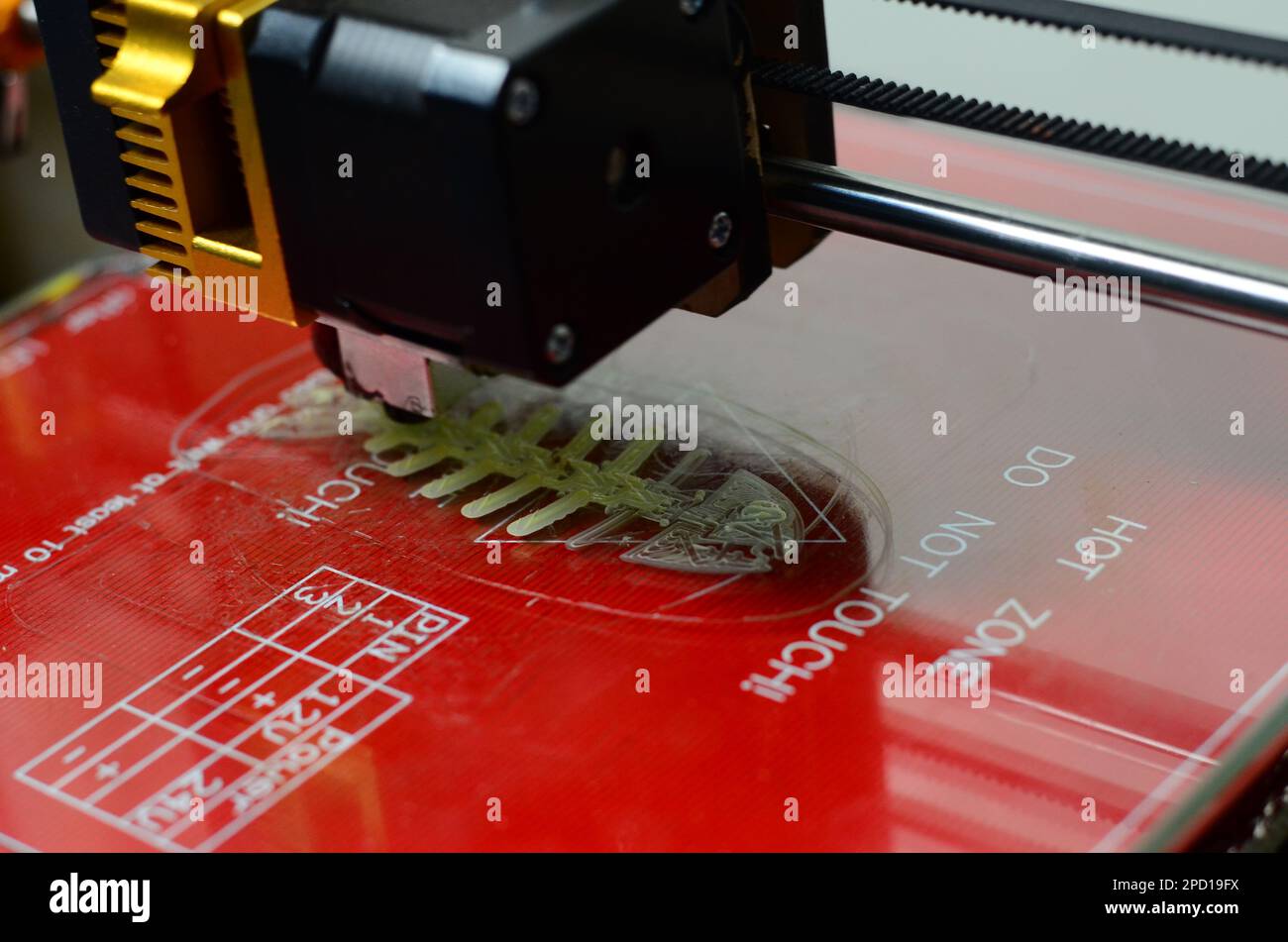3D printer prints red form Stock Photo - Alamy