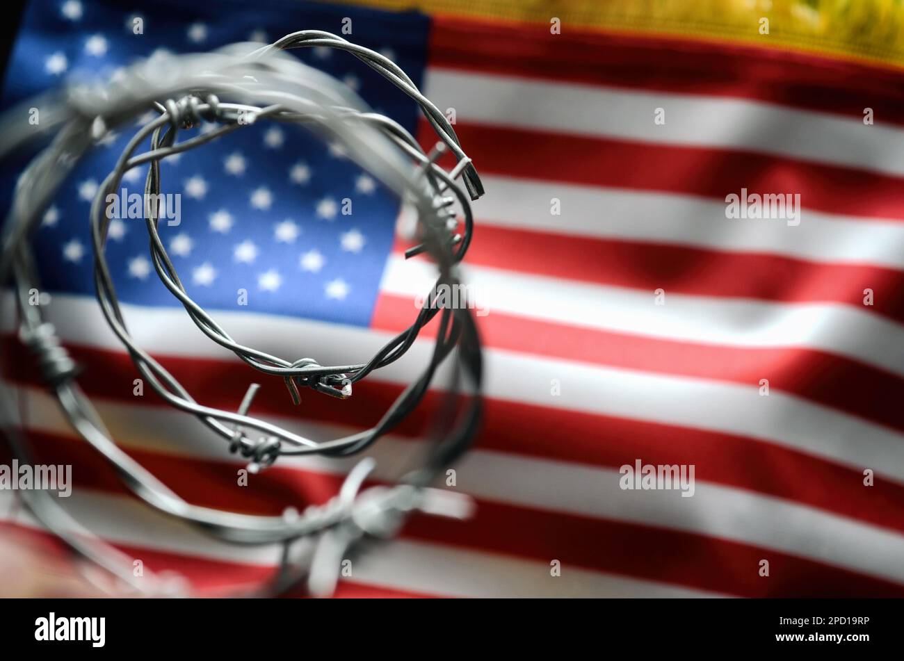 Barbed wire and United States of America flag , immigration concept ...
