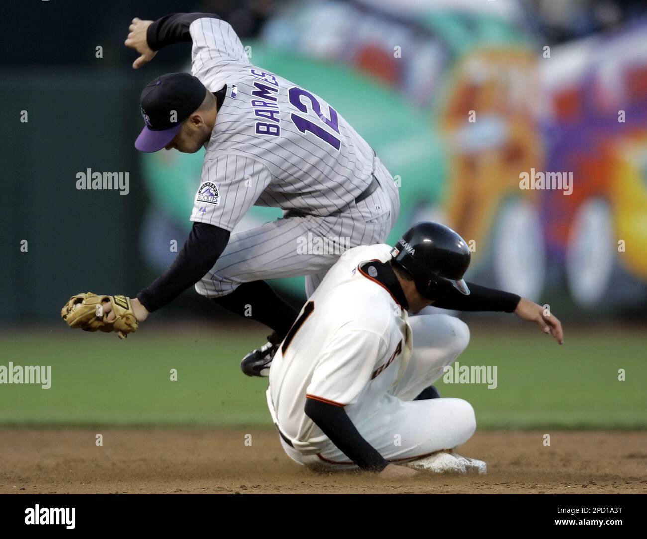 San Francisco Giants' Travis Ishikawa, bottom, is forced out at second ...