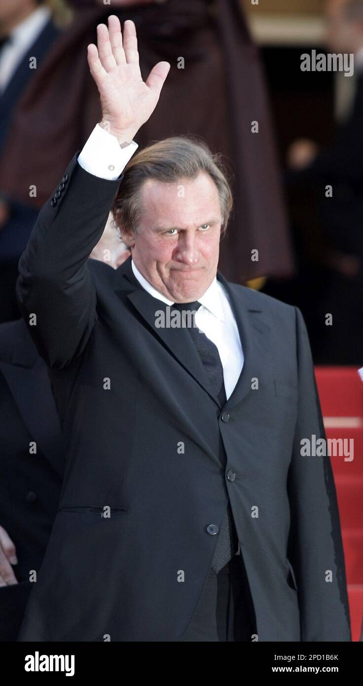 French actor Gerard Depardieu waves as he arrives for the screening of ...