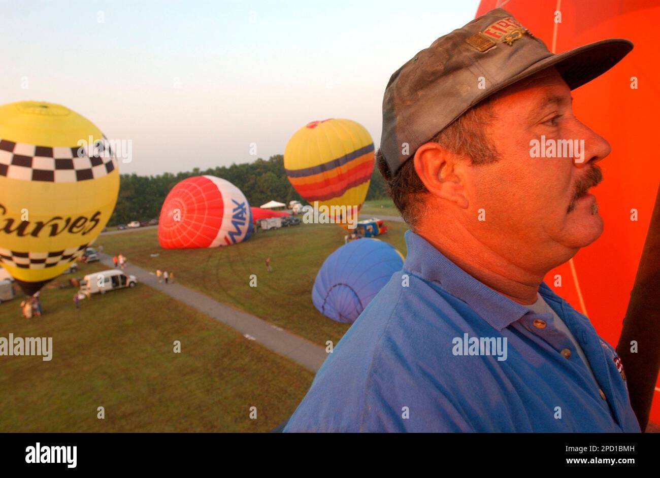 Mark Fritze of Tallahassee, Fla. pilots his hot-air balloon into the ...
