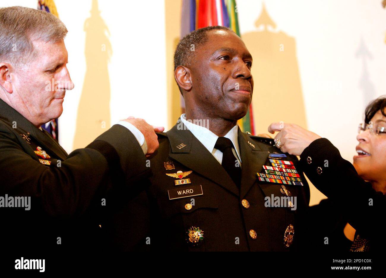 Army Lt. Gen. William E. Kip Ward, center, is pinned with his fourth ...