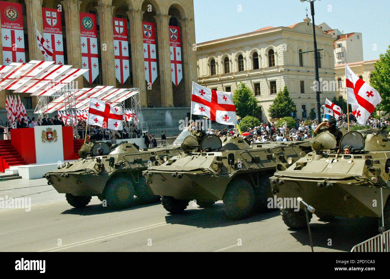Georgian soldiers in APCs salute during a military parade marking ...