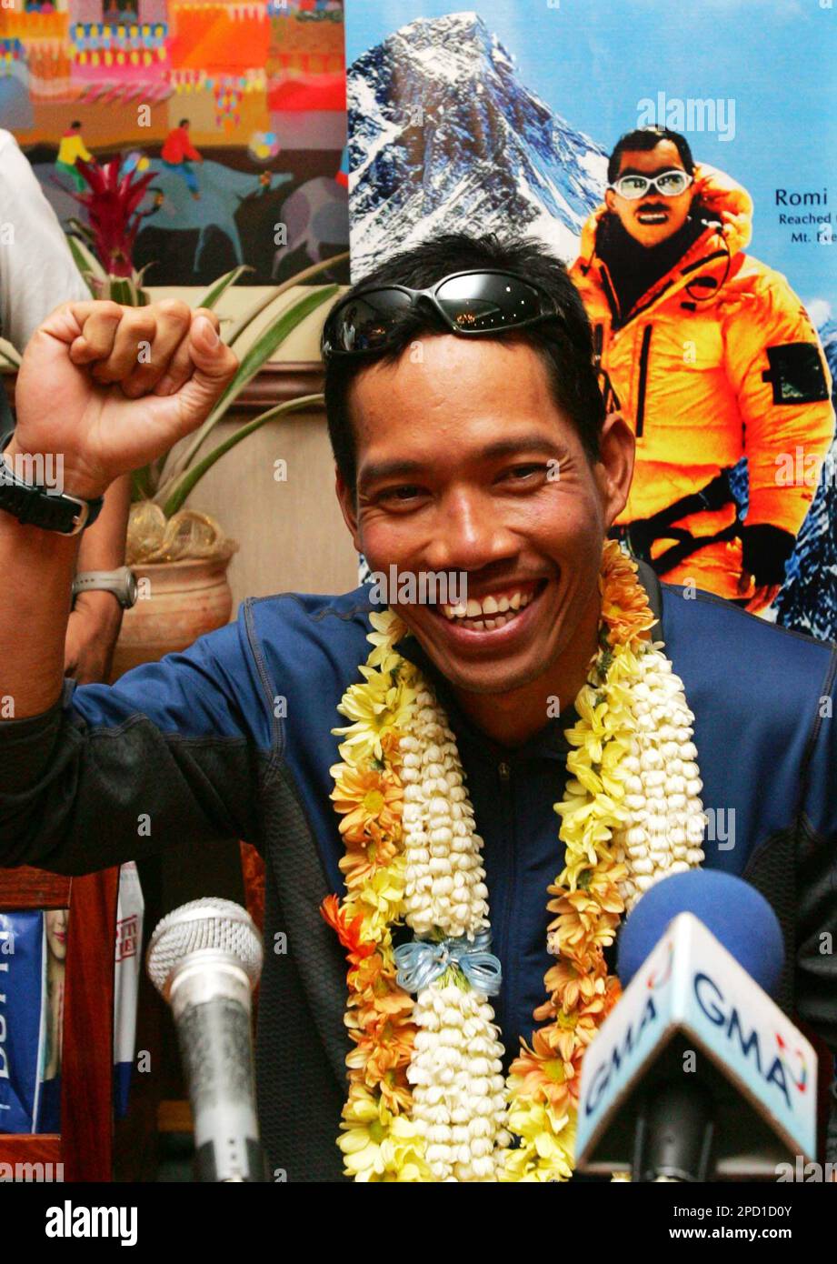 Filipino mountaineer Romeo Garduce clenches his fist as he greets the ...