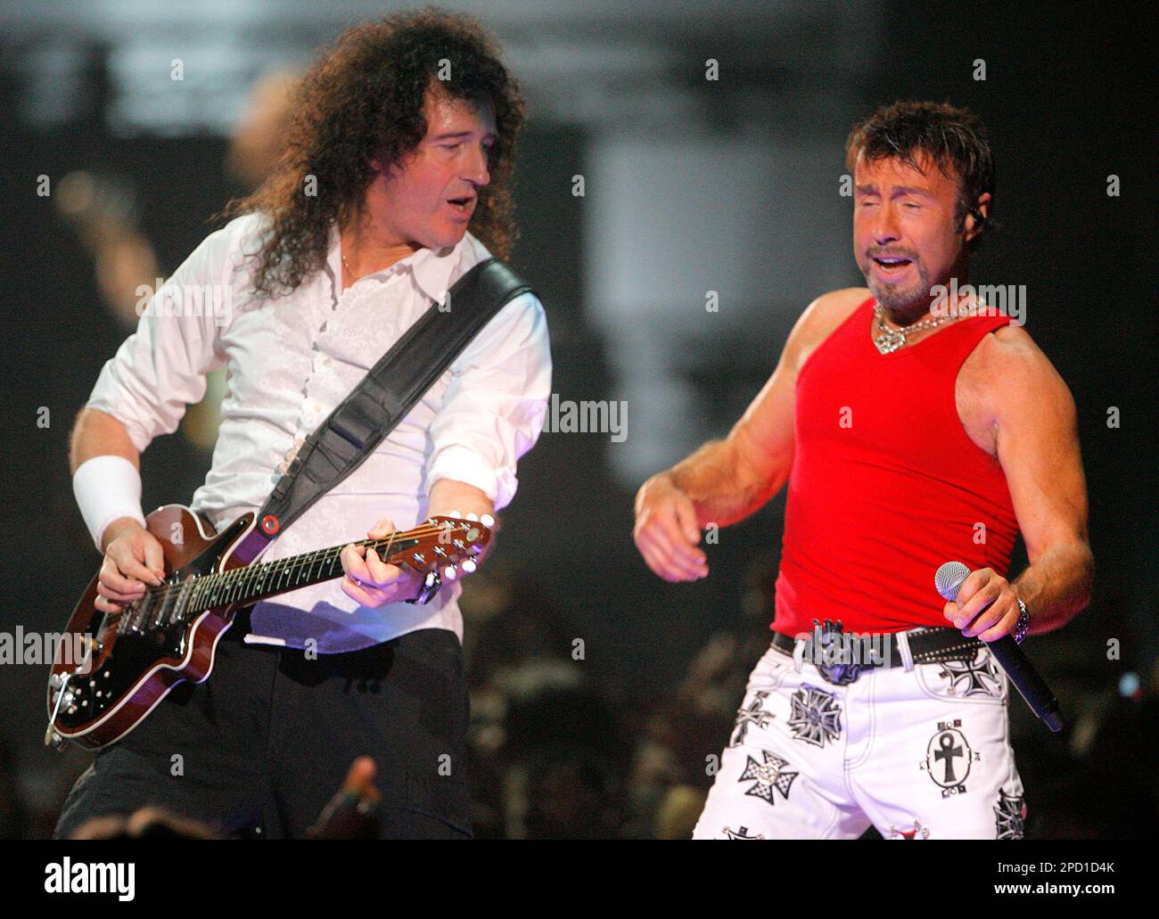 Paul Rodgers, right, performs with Queen guitarist Brian May, left ...