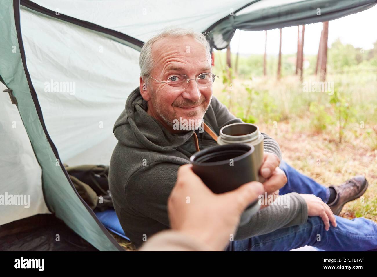 Man sitting in camping hi-res stock photography and images - Alamy