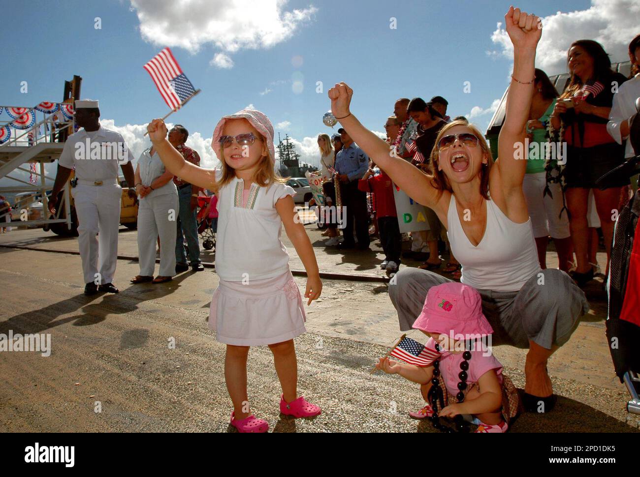 Micaca Fox, reacts at the return of her husband, Navy Lt. Tim Fox, with ...