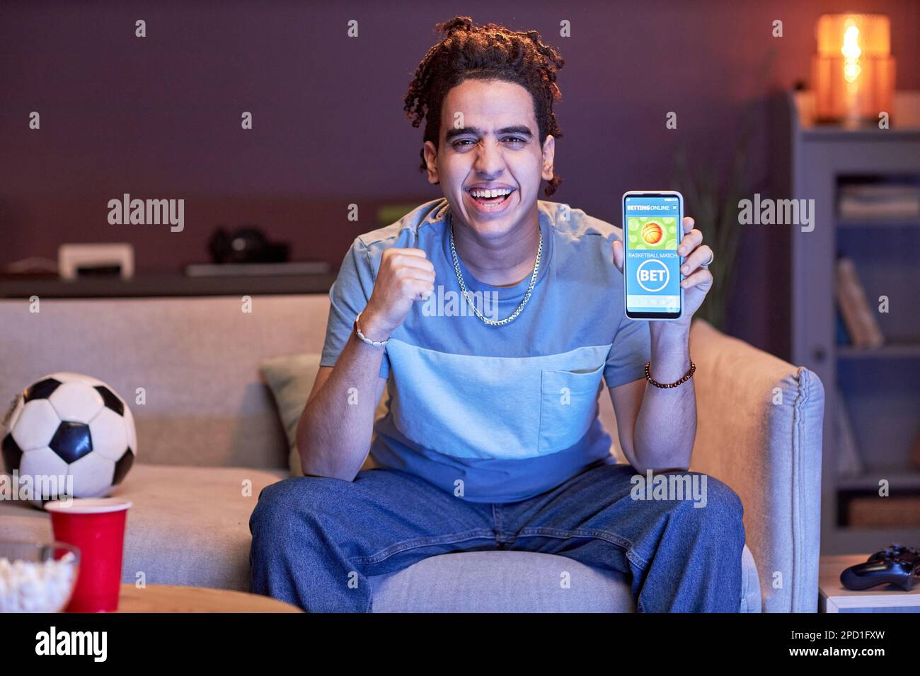 Excited young man watching sports hi-res stock photography and images ...